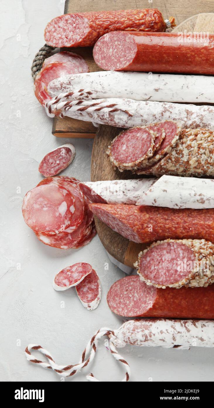 Sausages salami assortment on light background. Meat product made of ...