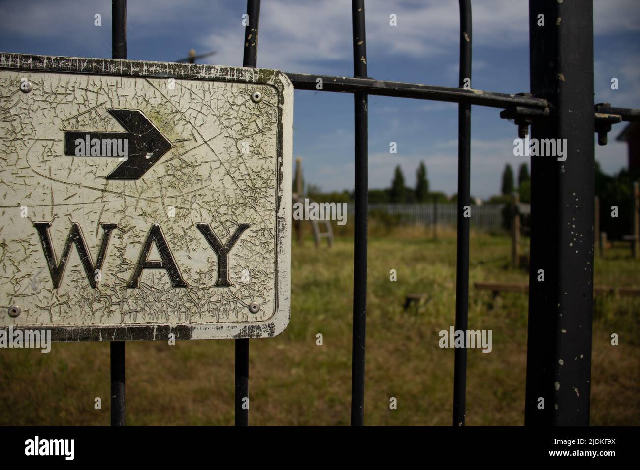 detail of WAY cracked and old corner edge of a directional sign with ...