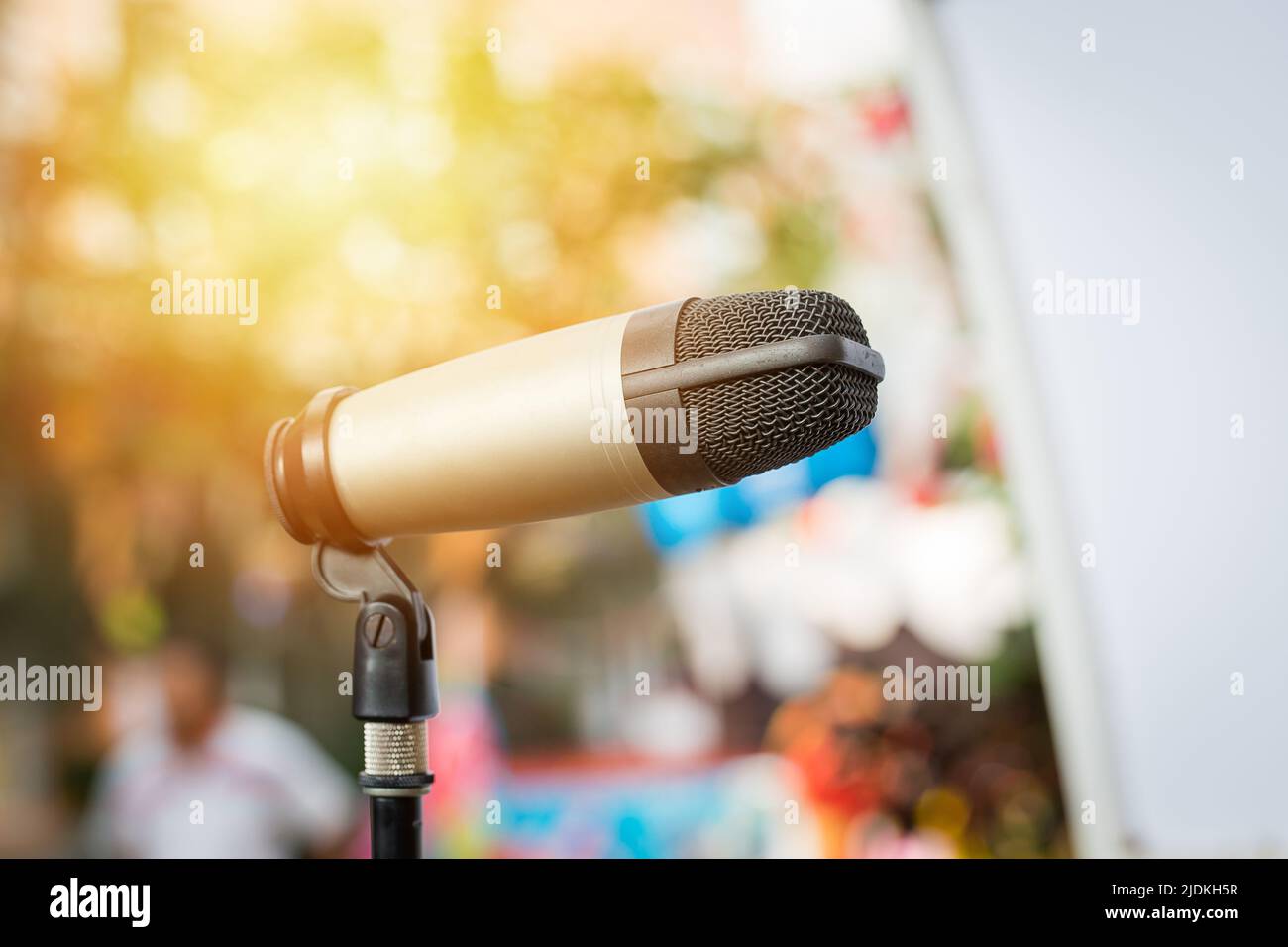 Close up of microphone in public place with blur background Stock Photo ...