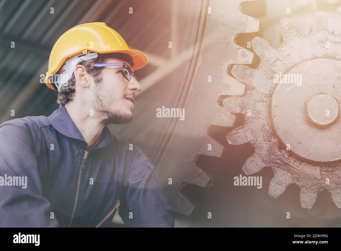 Caucasian Engineer staff worker working overlay with metal gear ...