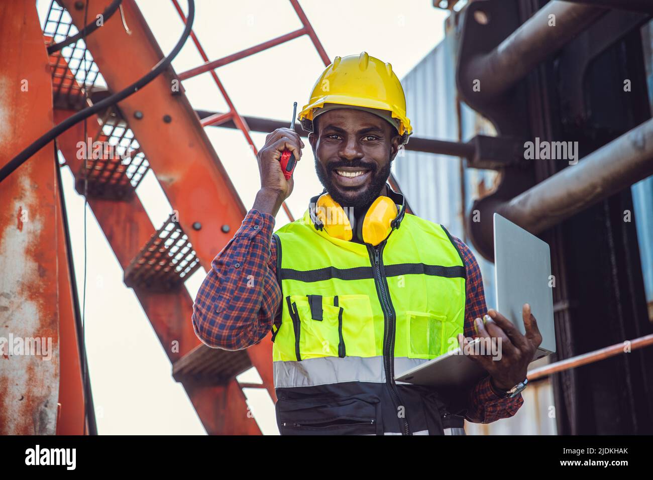 black worker African working engineer foreman radio control in port ...
