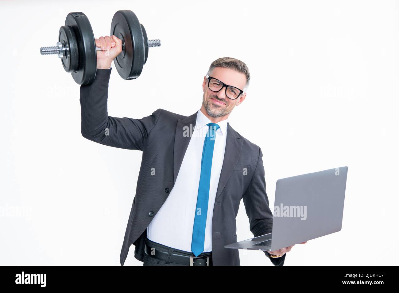 strong businessman in suit hold heavy dumbbell and laptop isolated on ...