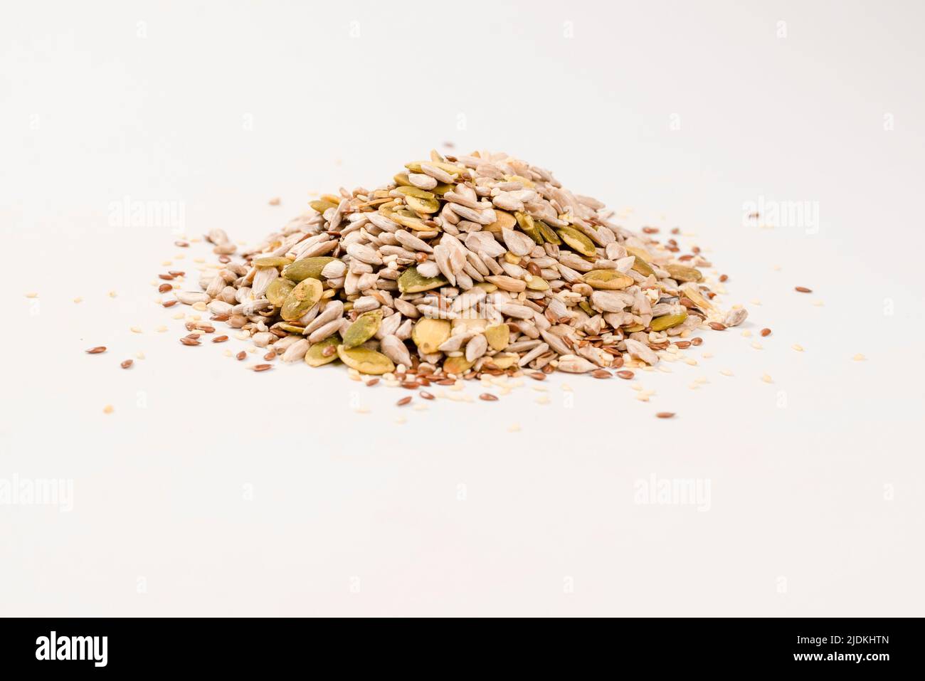 Mixed seeds pile isolated sunflower hi-res stock photography and images ...