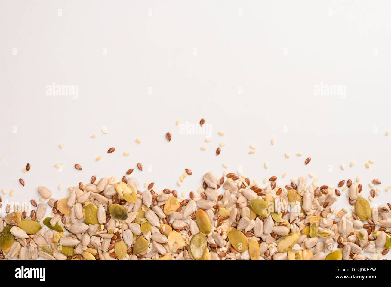 Mix of seeds for a salad. A pile of mixed seeds isolated on a white ...