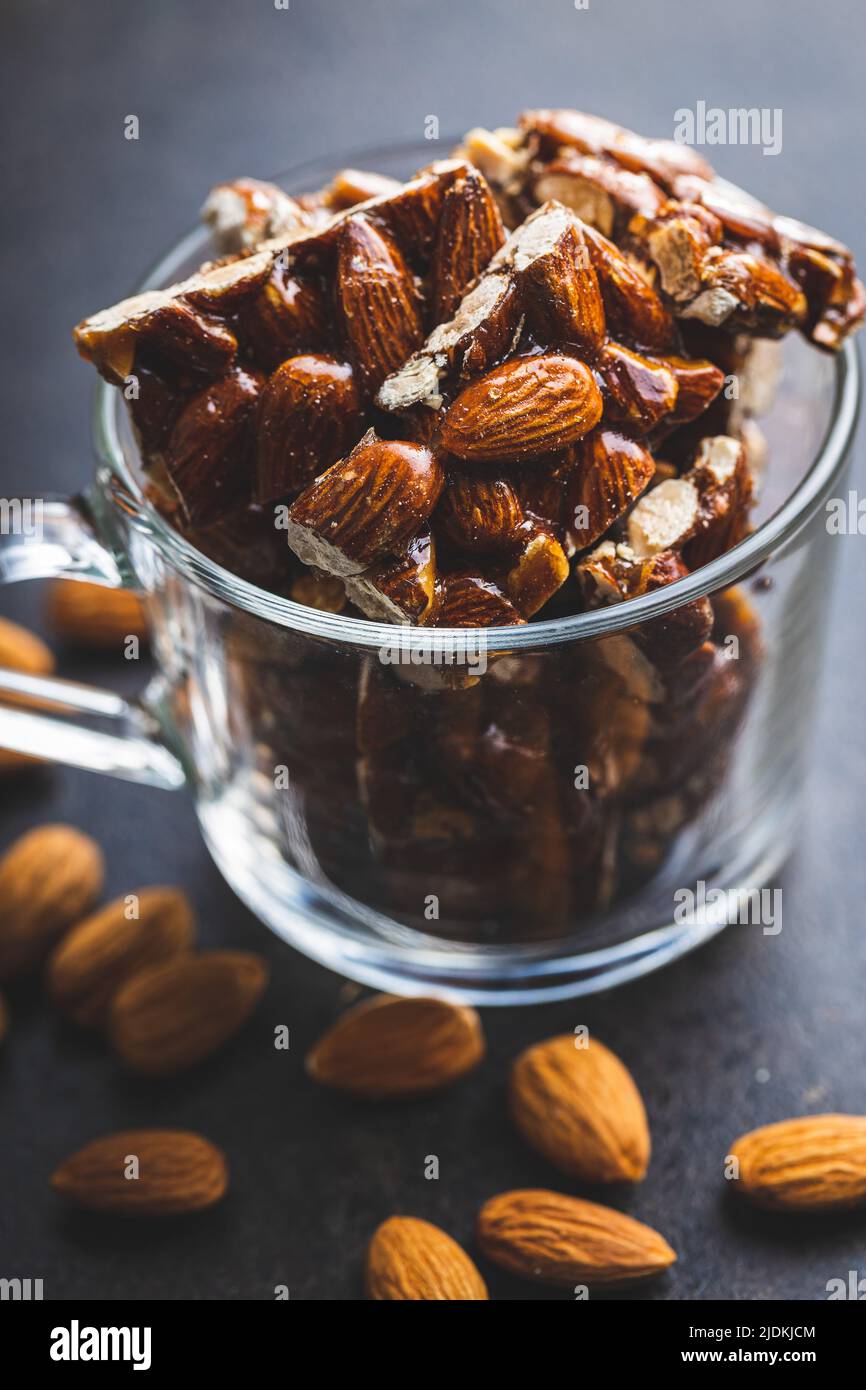 Sweet mini almond bars on a black table Stock Photo - Alamy