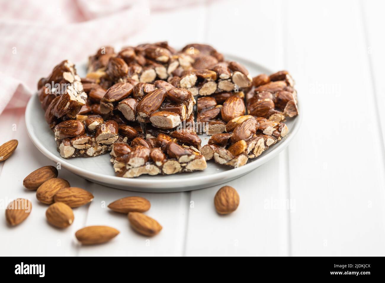 Sweet mini almond bars on a white table Stock Photo - Alamy