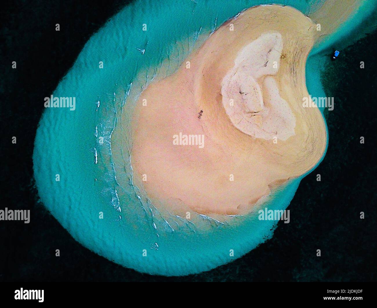 Aerial view of a white sand islet surrounded by turquoise sea – Indian ...