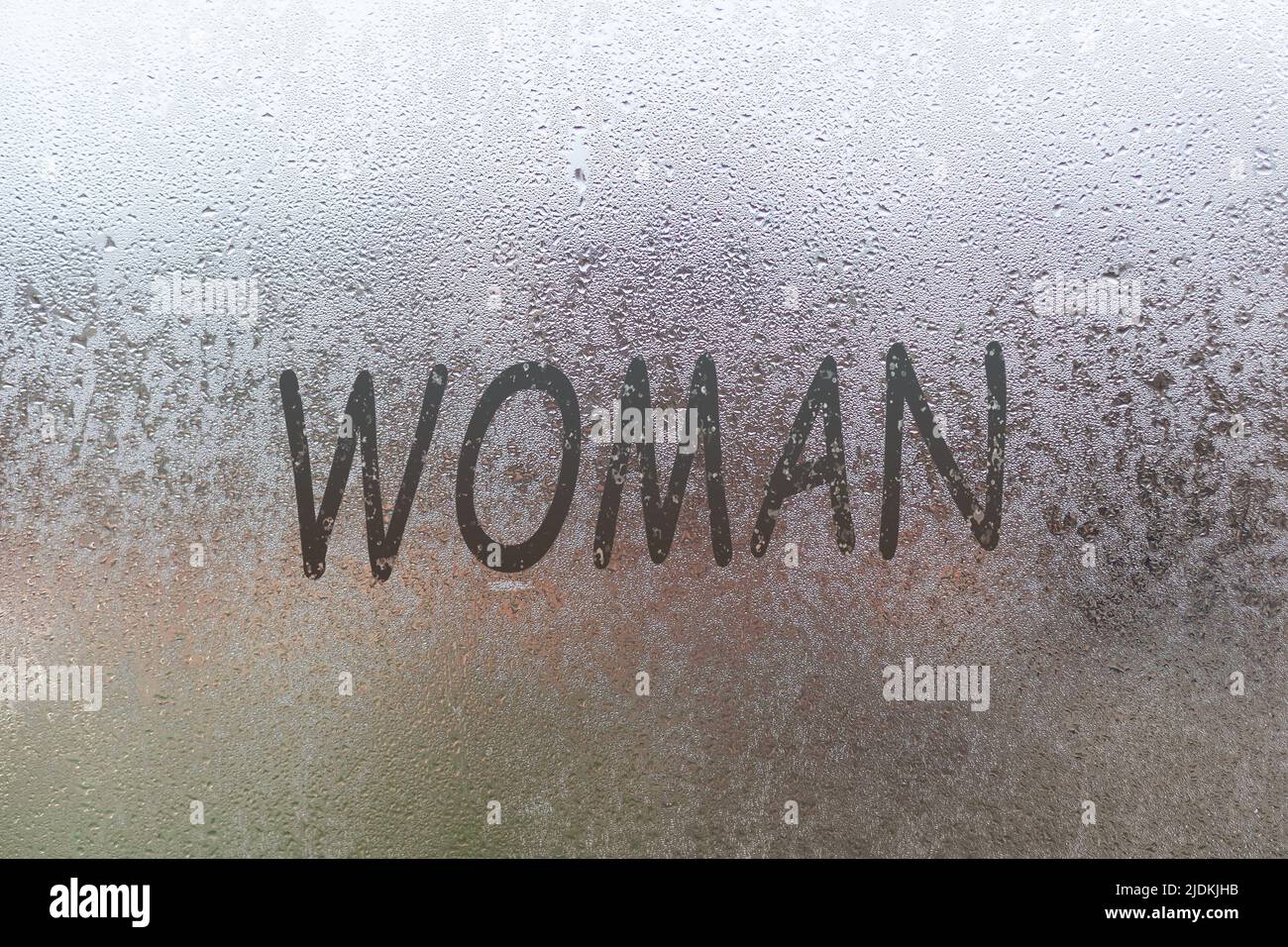 Word woman. Abstract background with drops of water. Inscription on ...