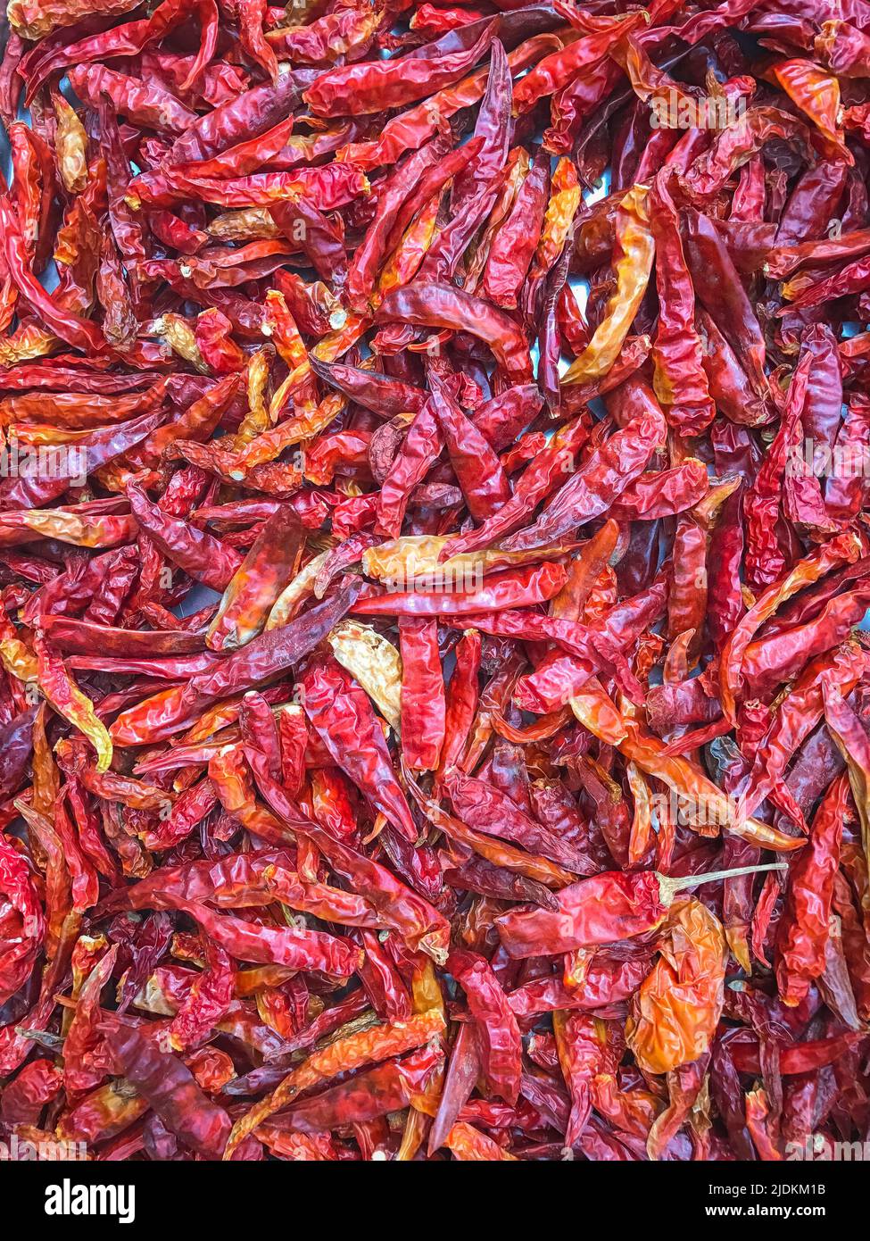 Dry red chili pepper background Stock Photo - Alamy