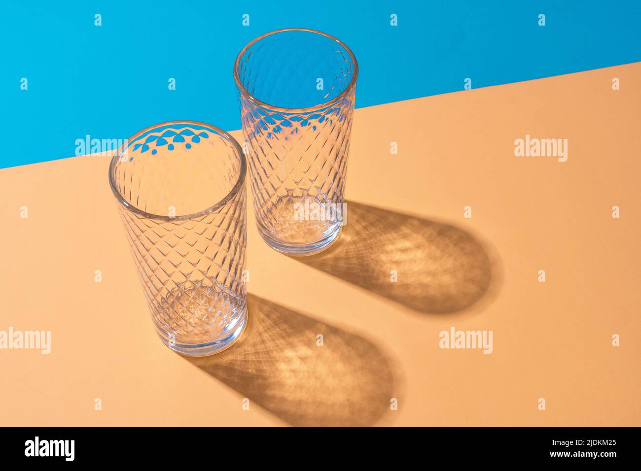 Empty transparent glass on a color background with copyspace Stock ...