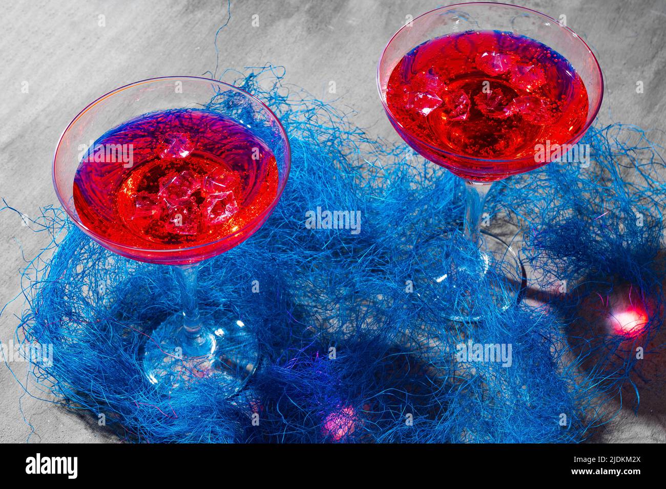Cold pink cocktail on concrete background close up Stock Photo - Alamy