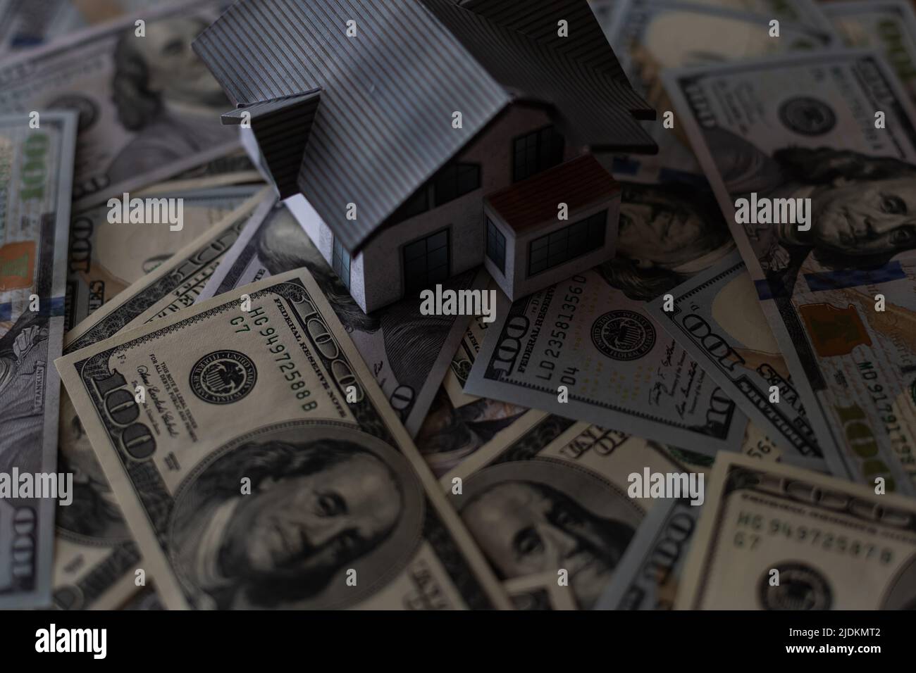 Background from money. Scattered dollars. paper house Stock Photo - Alamy