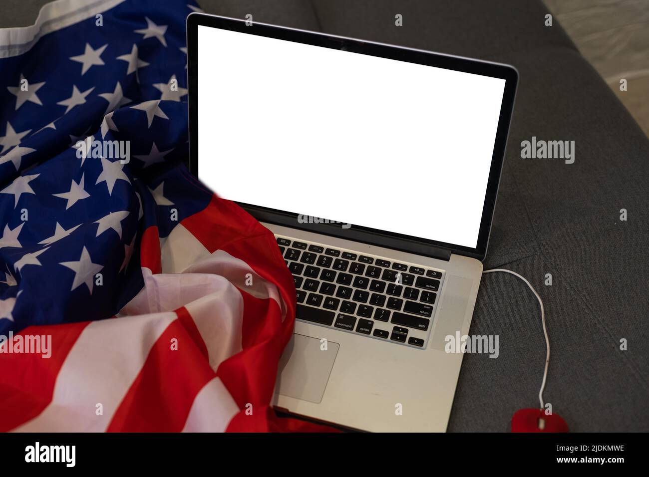 Laptop with blank screen and USA flag Stock Photo - Alamy