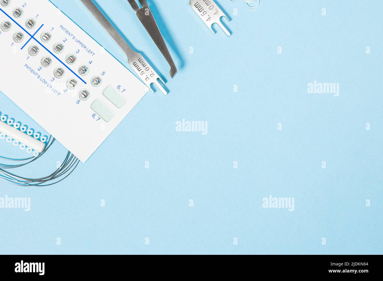 a set of special tools for an orthodontist to install braces for a ...