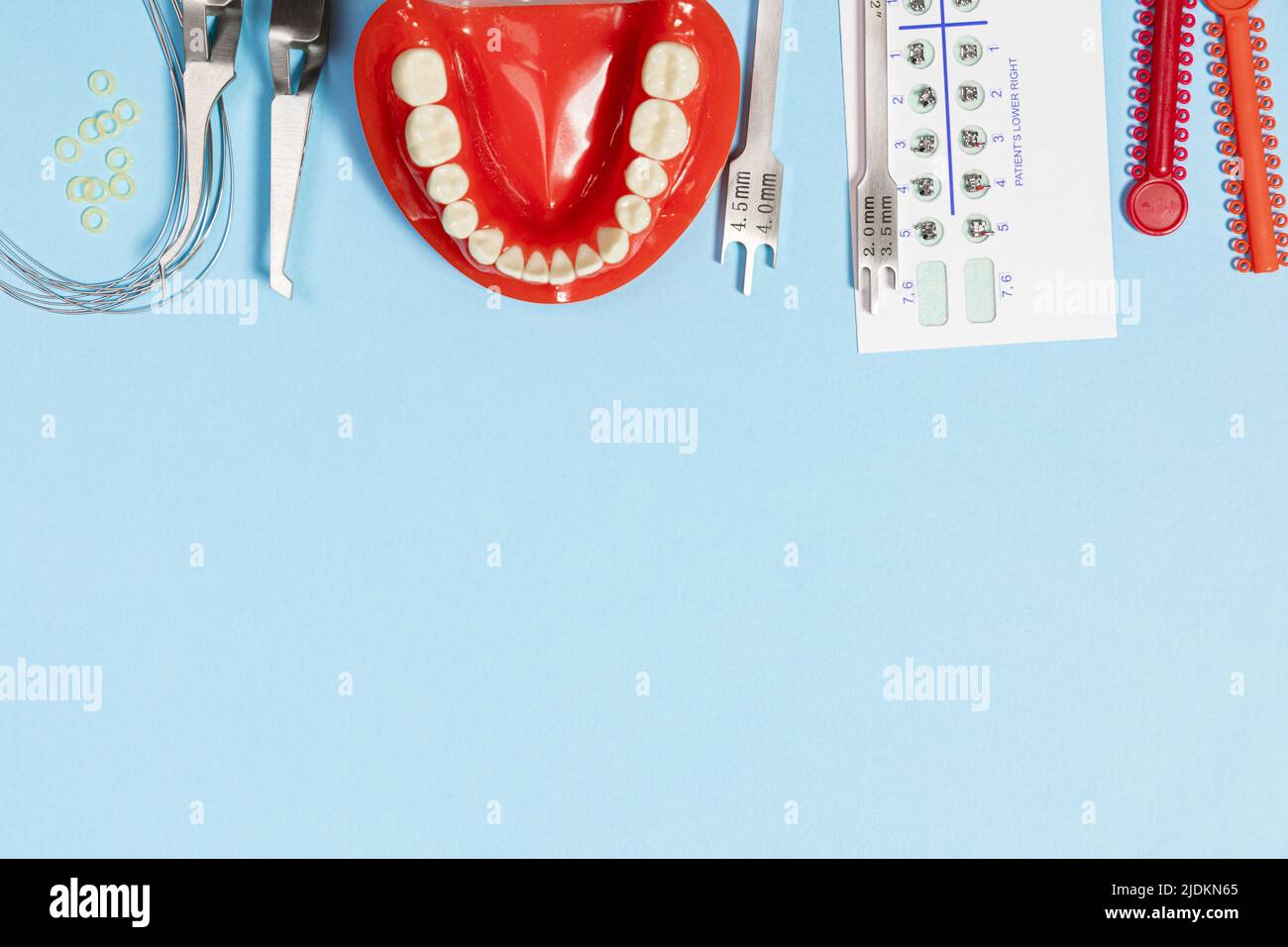 a set of special tools for an orthodontist to install braces for a ...