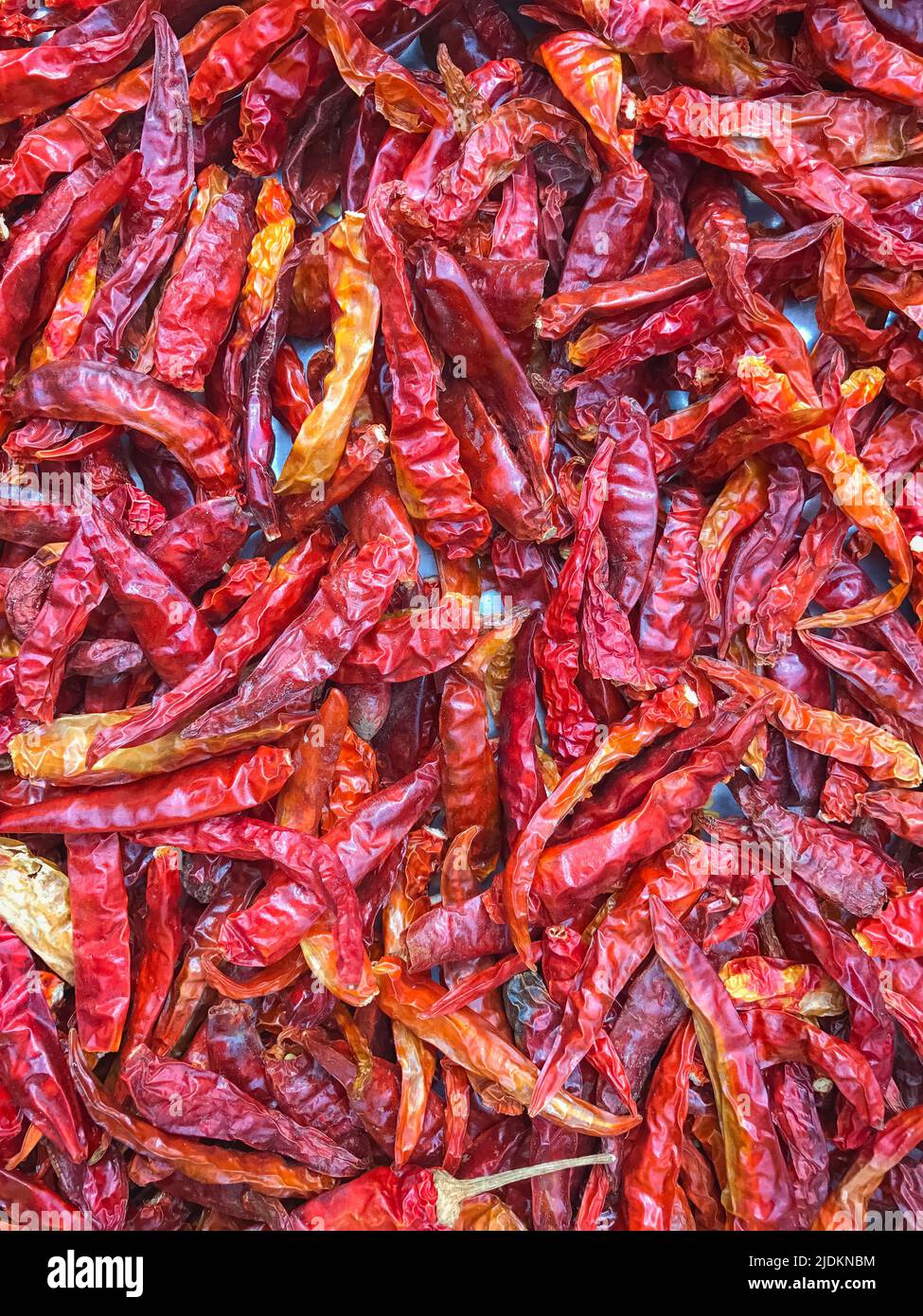 Dry red chili pepper background Stock Photo - Alamy