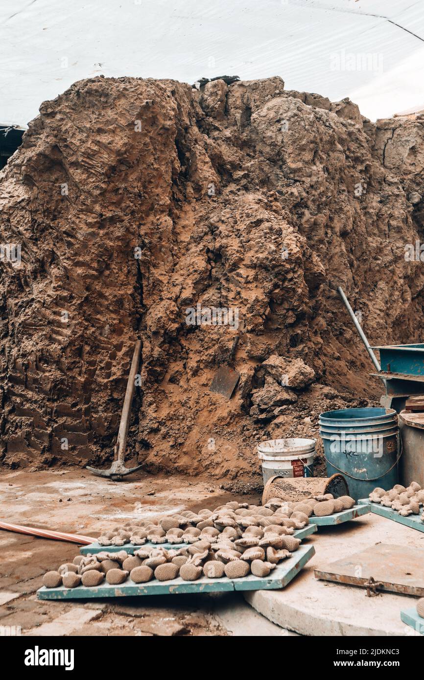 Visit to Thimi Ceramics in Bhaktapur, mount of clay in the back garden ...