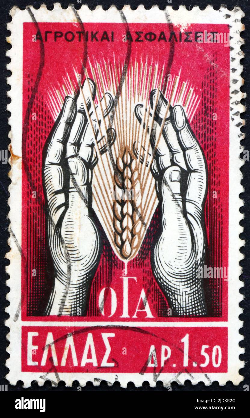 GREECE - CIRCA 1962: a stamp printed in Greece shows Hands and Grain ...