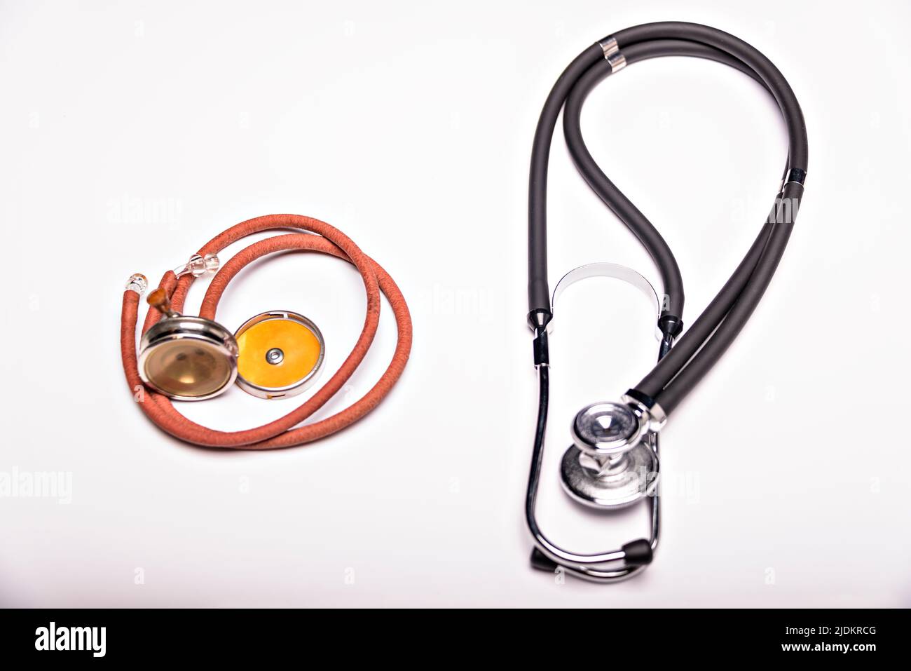 Old stethoscope next to modern stethoscope isolated on white background ...