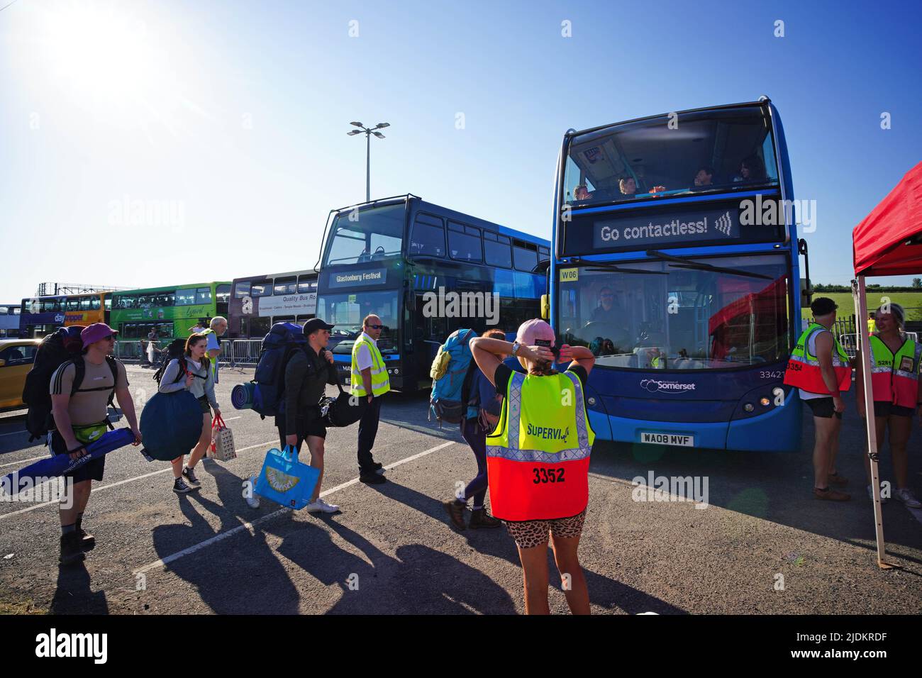 People board a bus at Castle Cary station heading to the Glastonbury ...