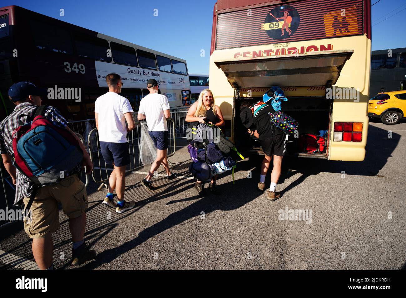 People board a bus at Castle Cary station heading to the Glastonbury ...