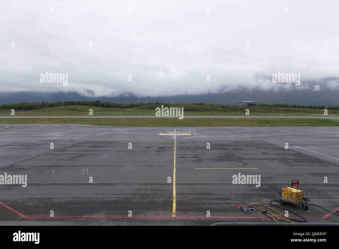 Empty runway in rural Norway with dense fog, illustrating cancelled ...