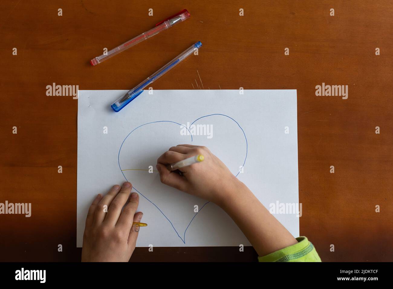 Close-up of childs hands drawing a heart Stock Photo - Alamy