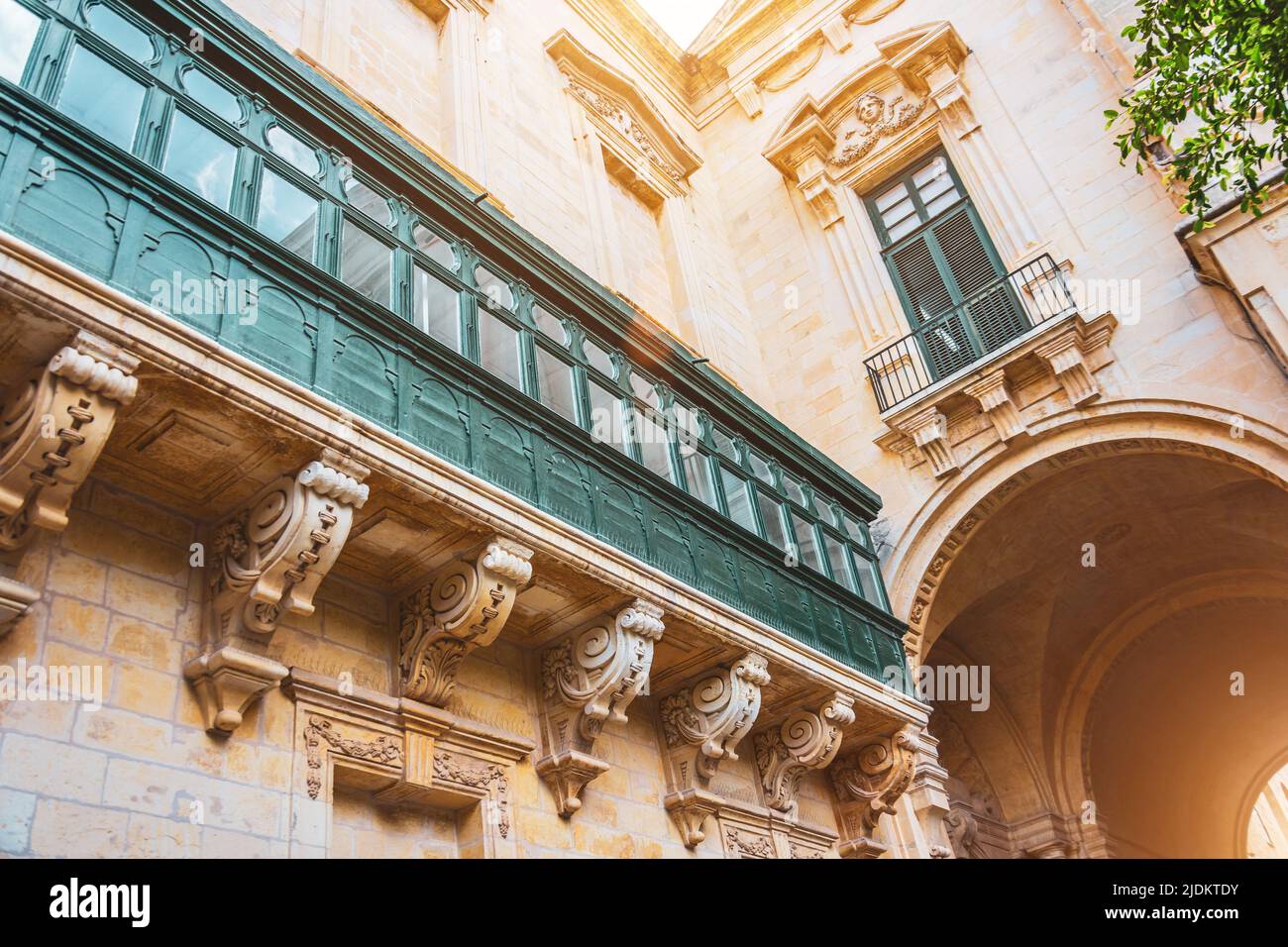 Malta's long large green traditional style balconies and arch in the ...