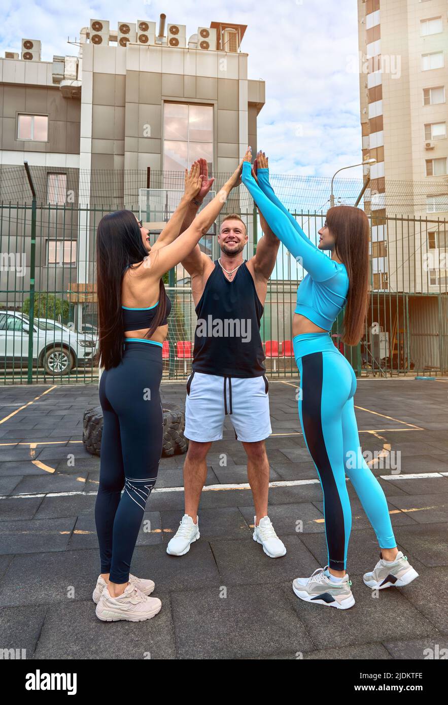 happy athletes clap their hands Stock Photo - Alamy
