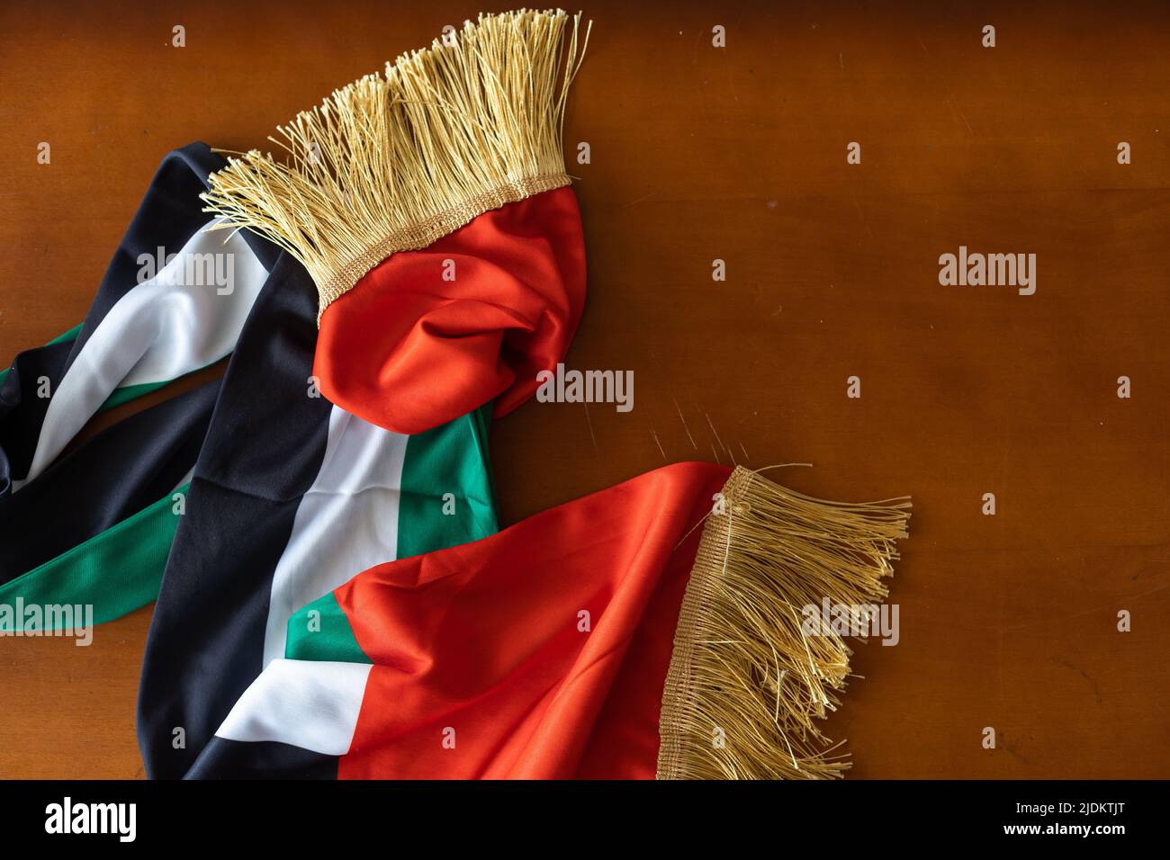 waving fabric texture of the flag with color of united arab emirates ...
