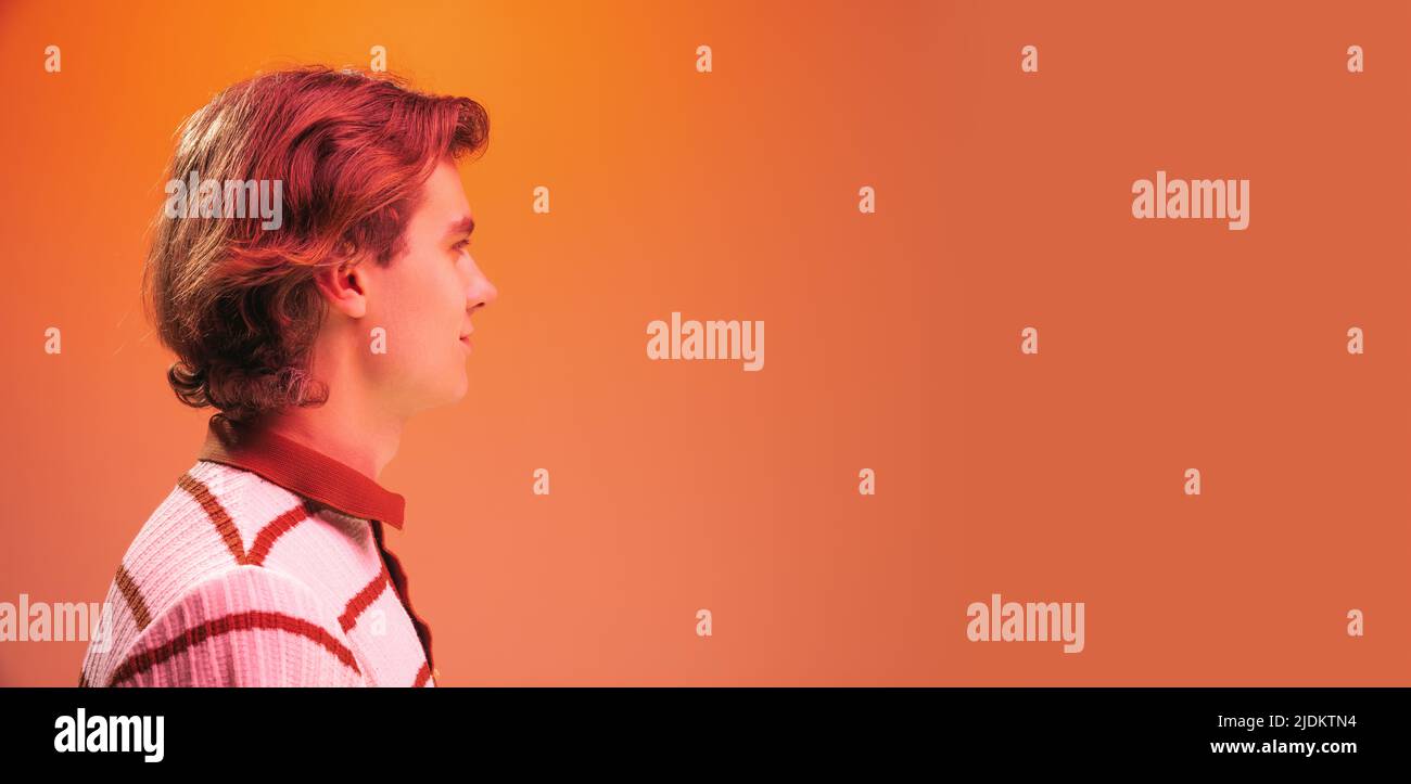 Side view portrait of young handsome man posing, looking away isolated ...