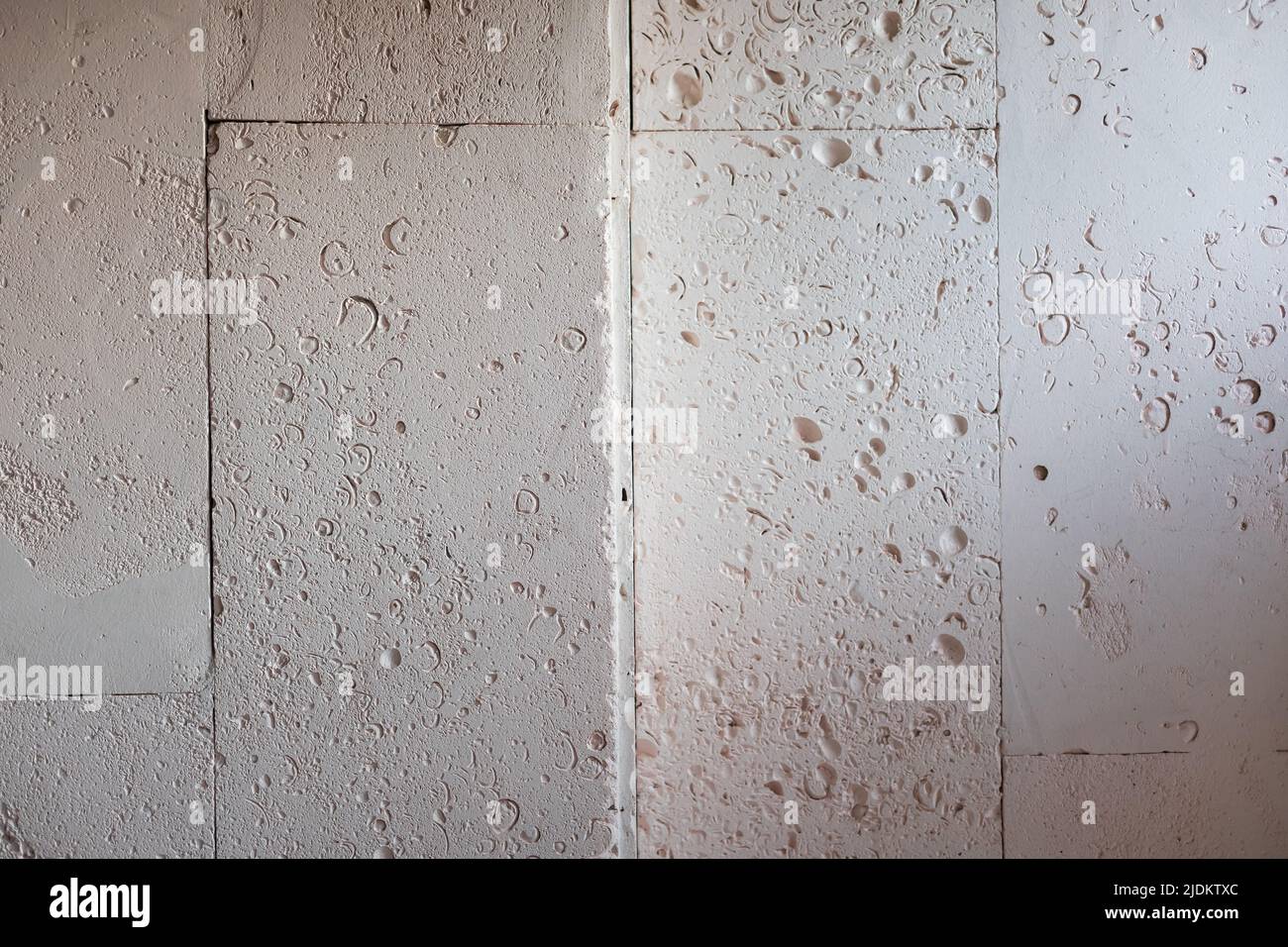 Textured wall lined with shell rock tiles Stock Photo - Alamy
