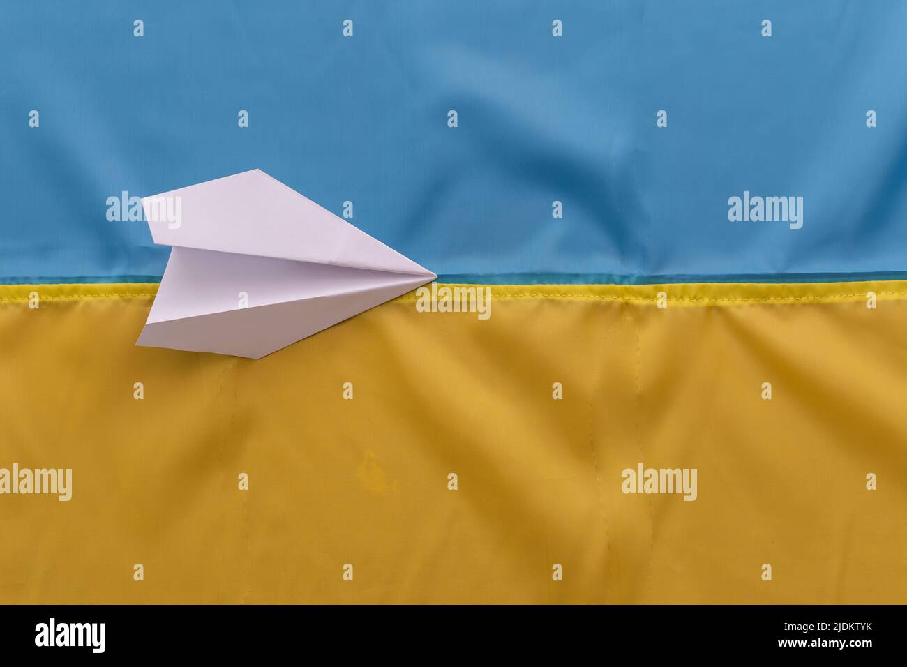 paper airplane on the background of the flag of Ukraine Stock Photo - Alamy