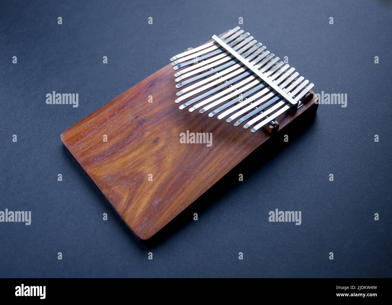 Traditional wooden kalimba isolated on black background Stock Photo - Alamy