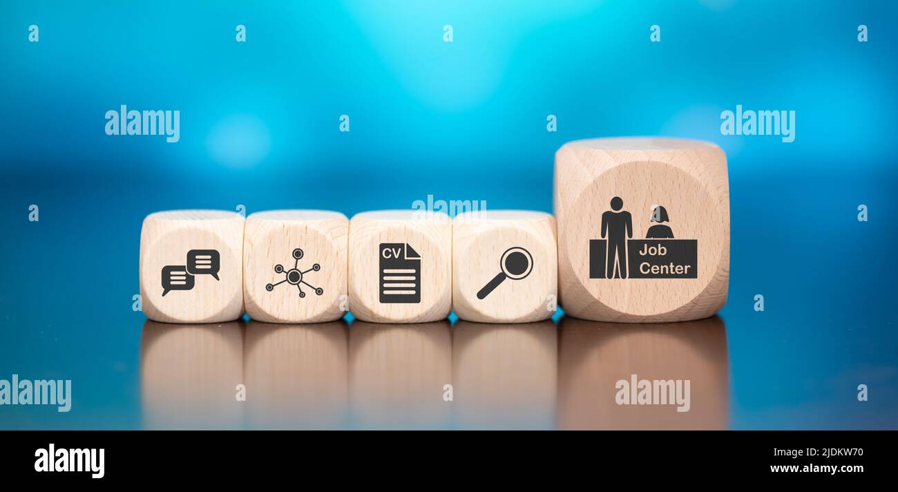 Wooden blocks with symbol of job search concept on blue background ...