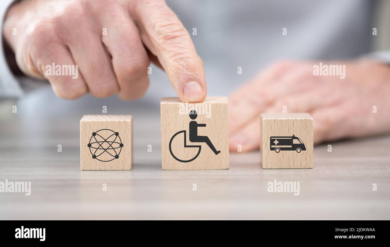 Wooden blocks with symbol of disability concept Stock Photo - Alamy