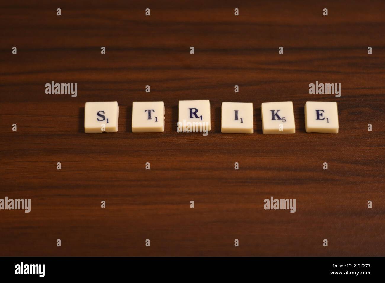 Selective focused close up shot of strike word. Made by using the ...