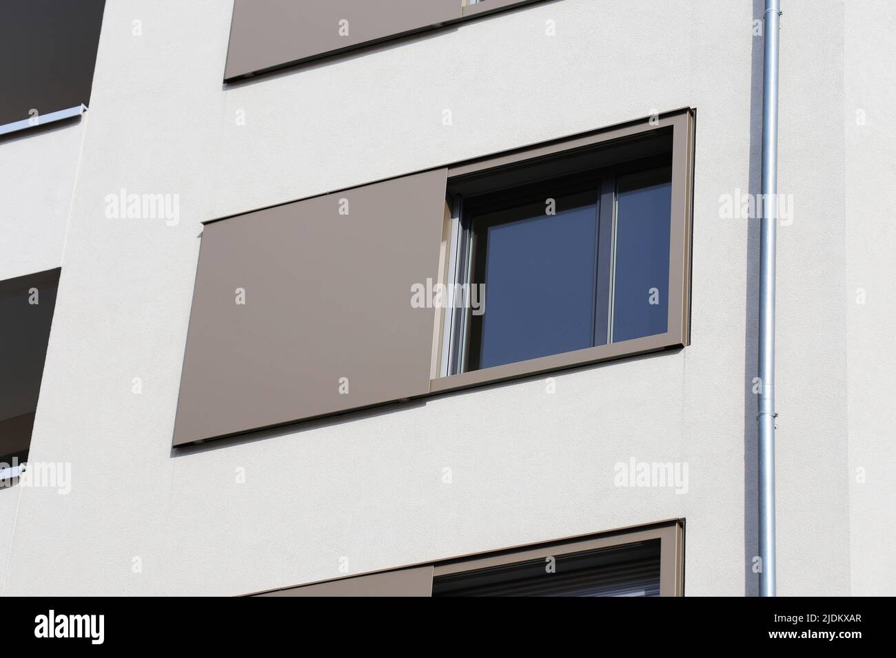 Windows with modern sliding shutters Stock Photo - Alamy