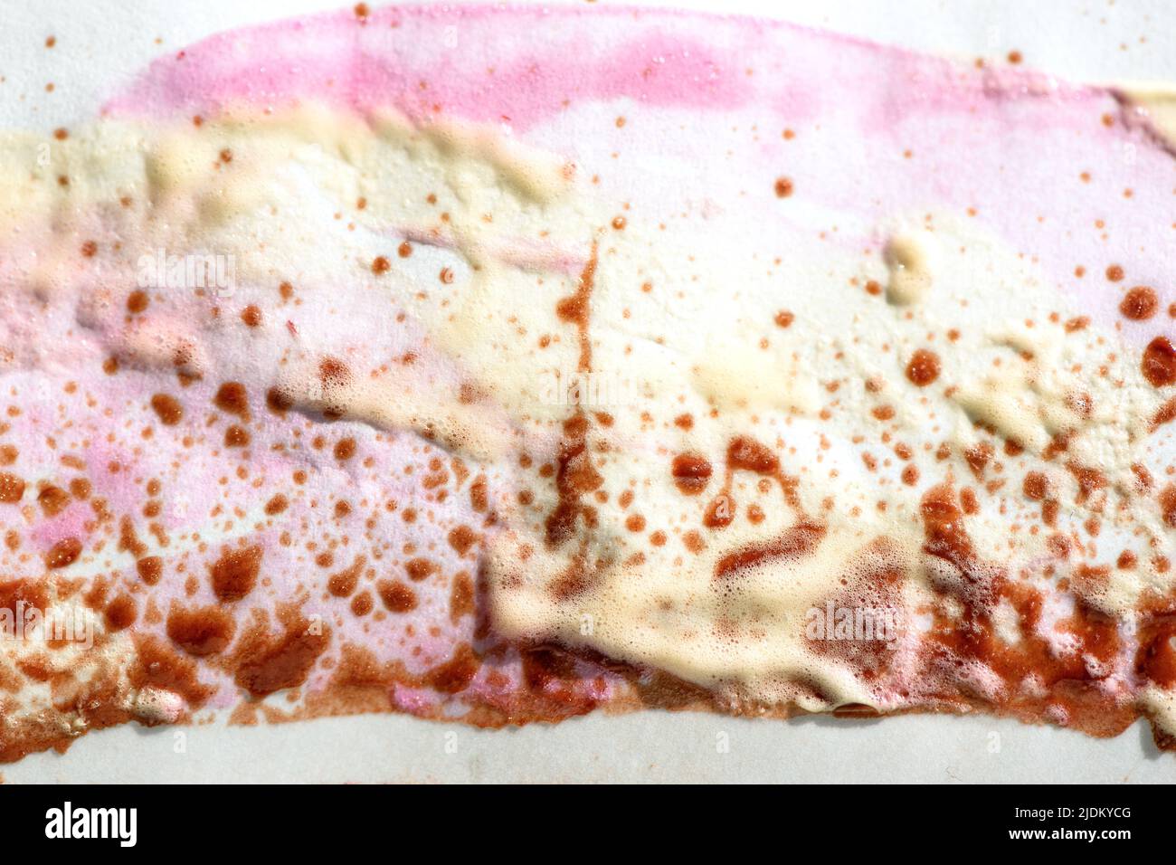 Abstract background of multi-colored drops of melted ice cream on paper ...