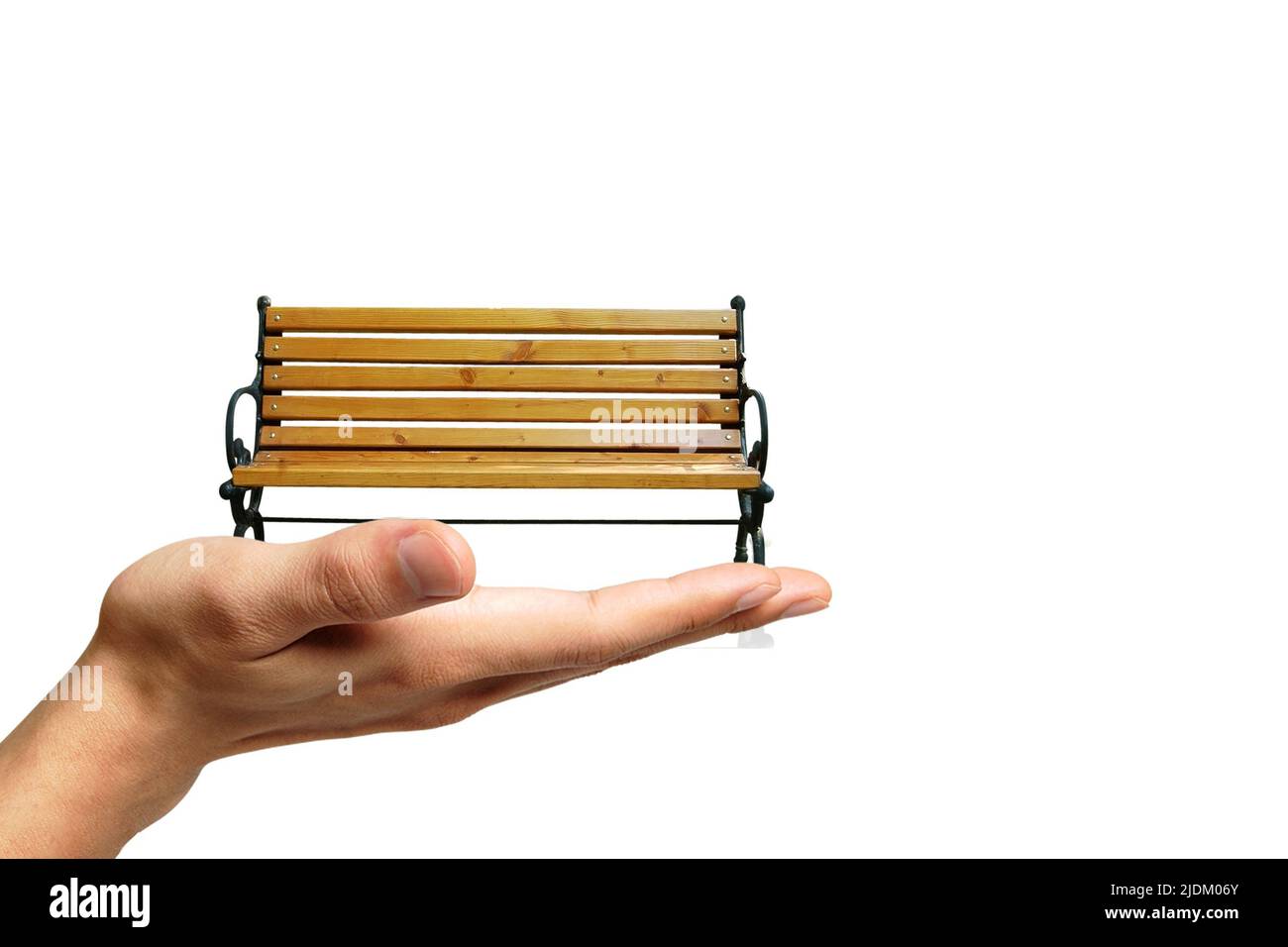 Classic garden bench on the human hand on the isolated background Stock ...