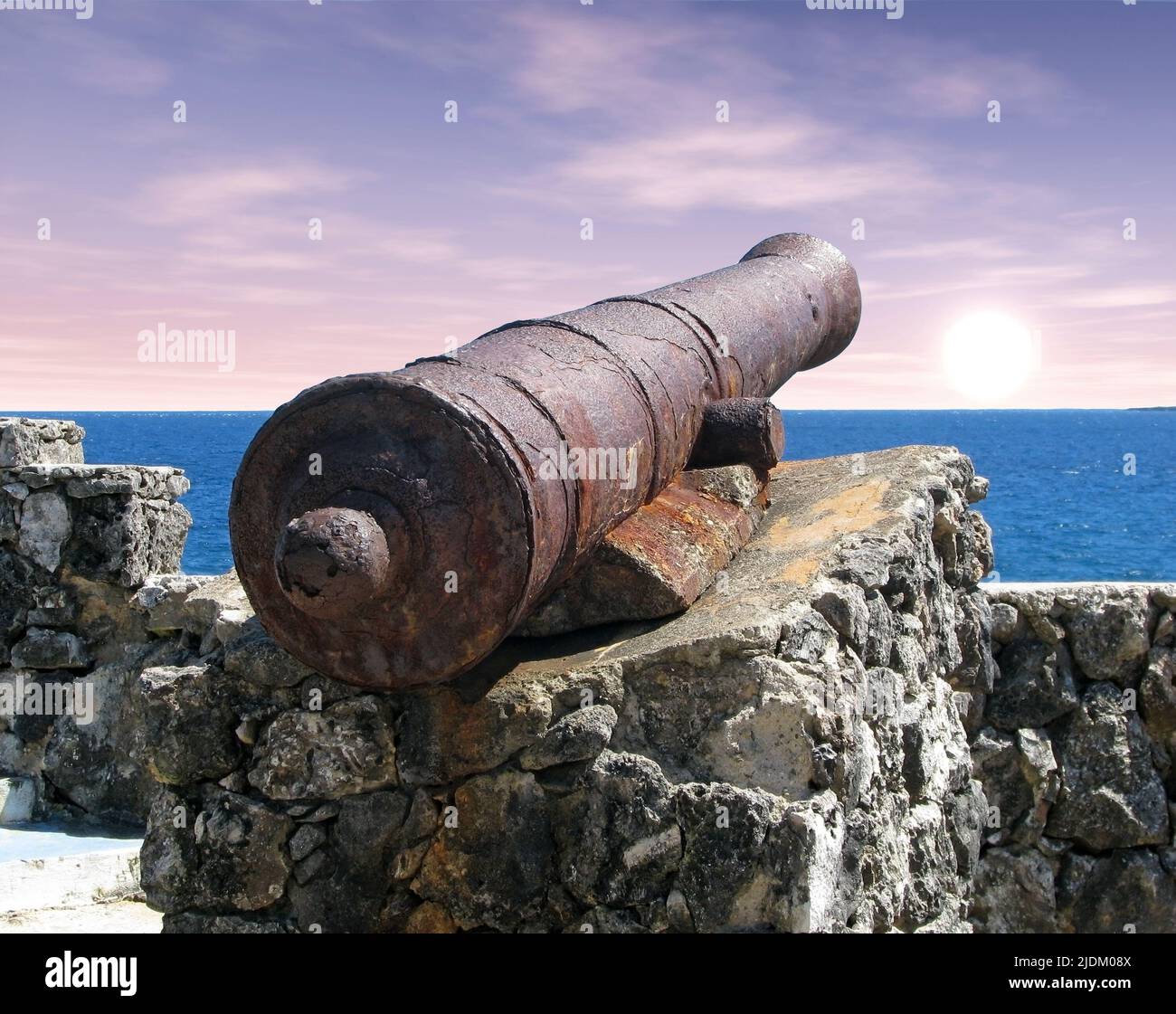 Colonial cannon in the ancient fortress on the caribbean coast at dawn ...