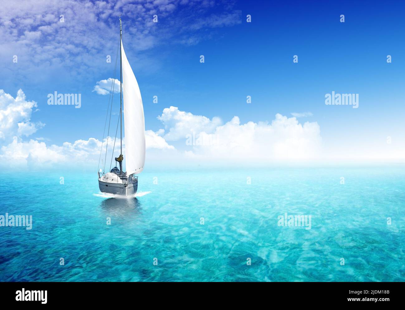 Sailing boat in the ocean with sunlight in the backgroiund Stock Photo ...