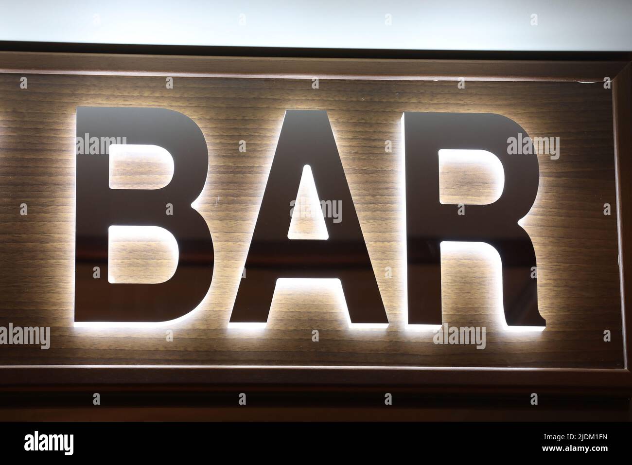 An old neon sign for a bar featuring a martini glass Stock Photo - Alamy