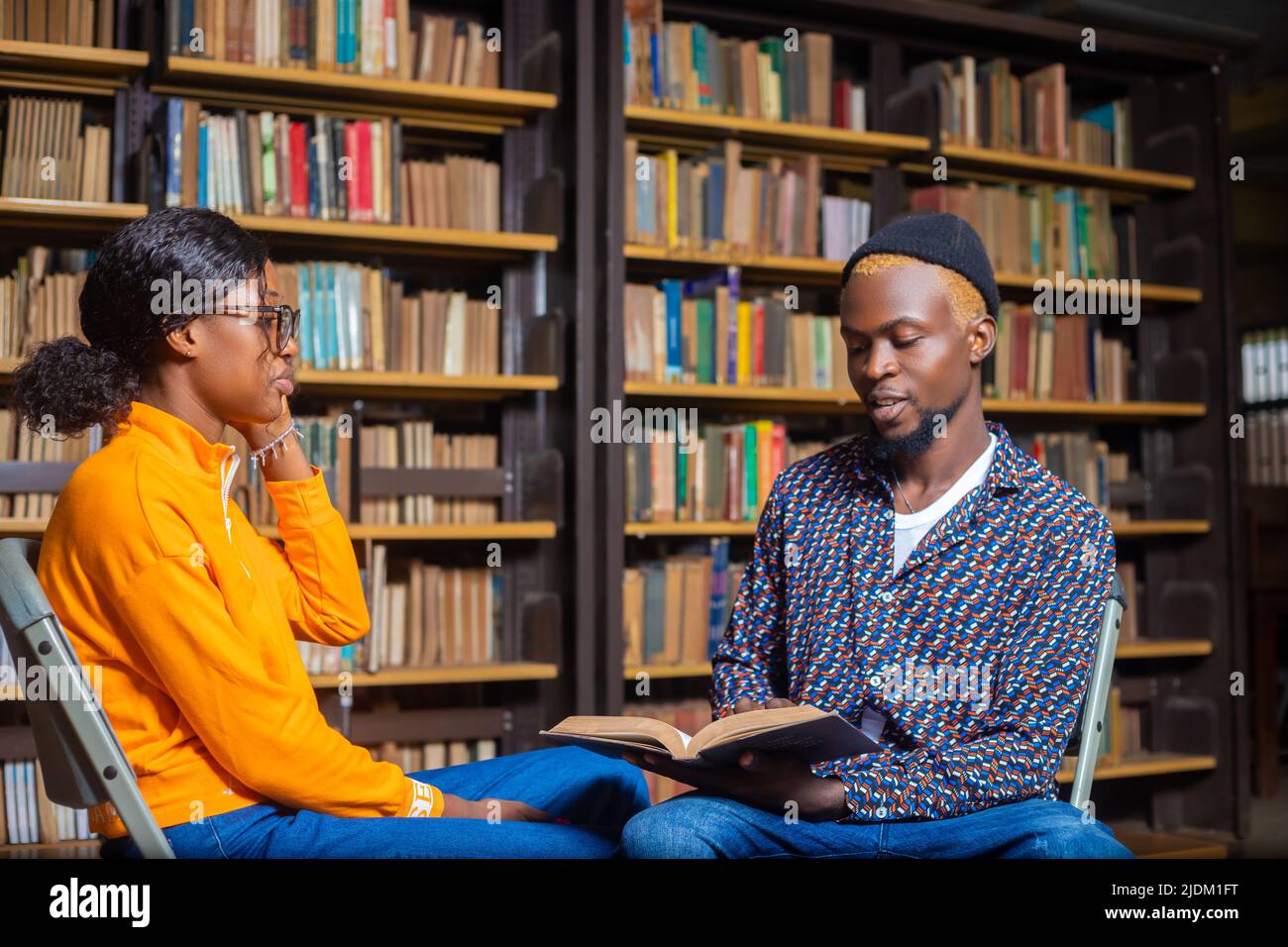 students with books preparing to exam in library Stock Photo - Alamy