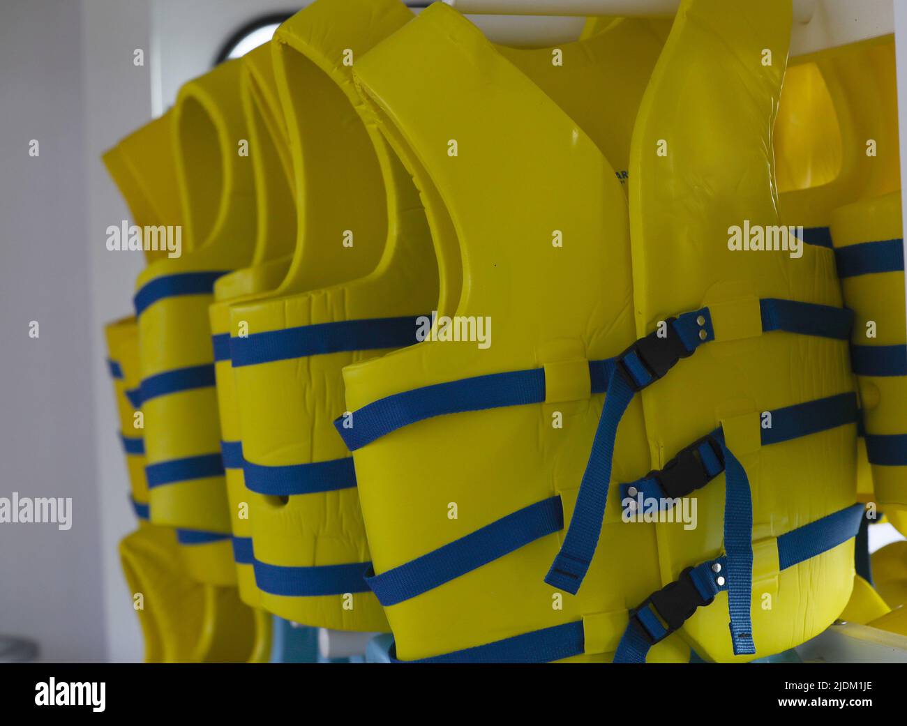 yellow safety lifejacket for the kids by swimming pool on cruise ship ...