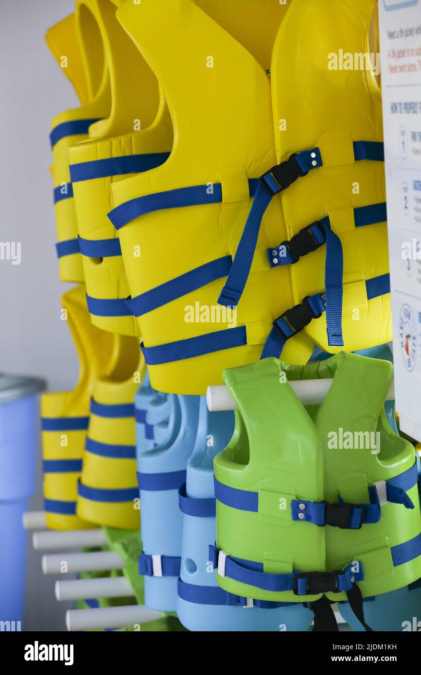 yellow safety lifejacket for the kids by swimming pool on cruise ship ...