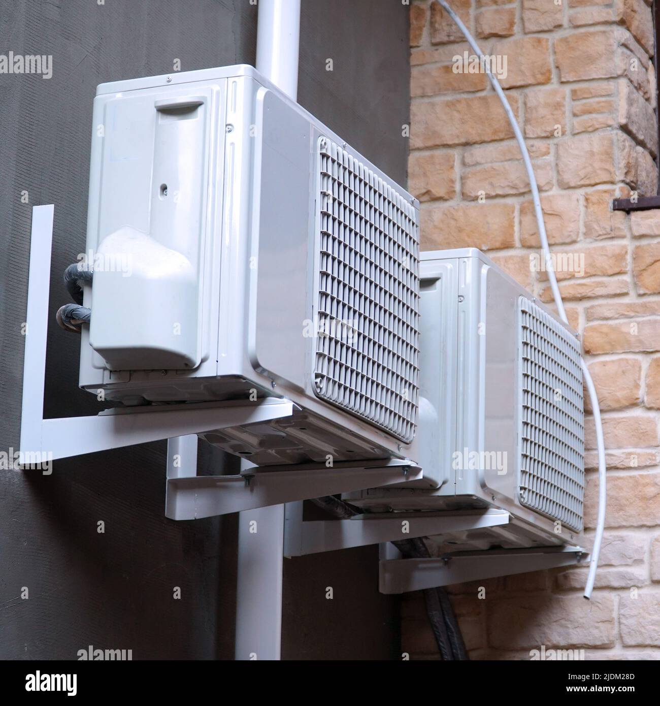 Air conditioners on the wall of the building Stock Photo - Alamy