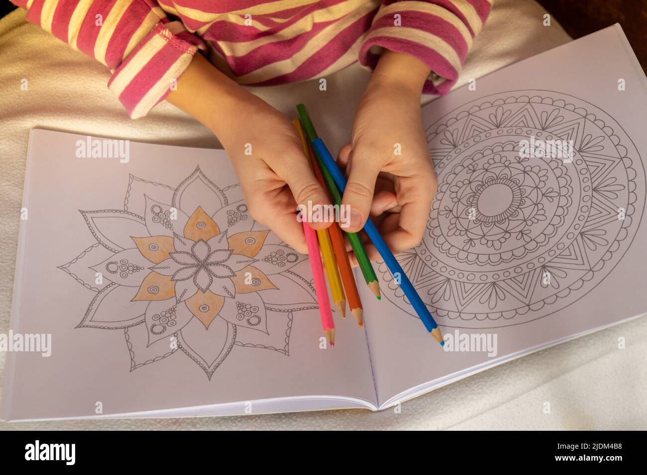 Woman coloring antistress page. Female hand painting mandala. Female ...