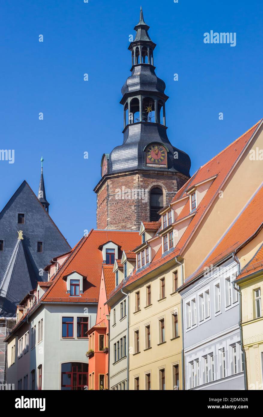 Old houses and church tower at the market square of Eisleben, Germany ...