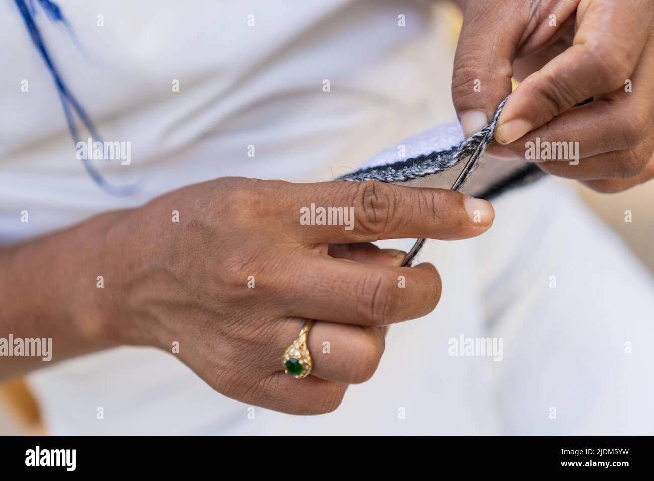 Hands of an indigenous woman from the Sierra Nevada de Santa Marta ...